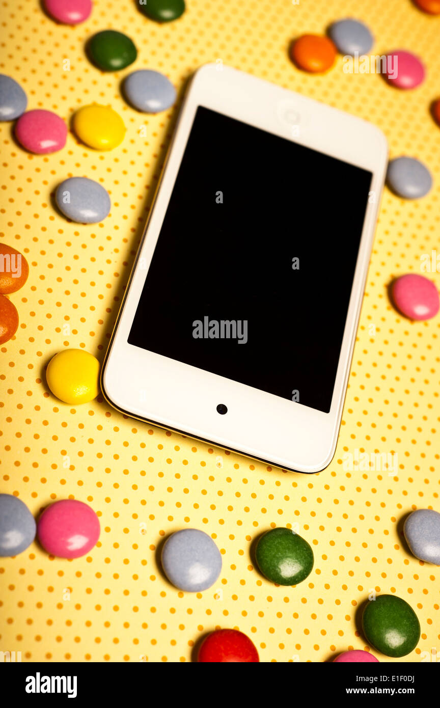colorful candies and smartphone Stock Photo - Alamy