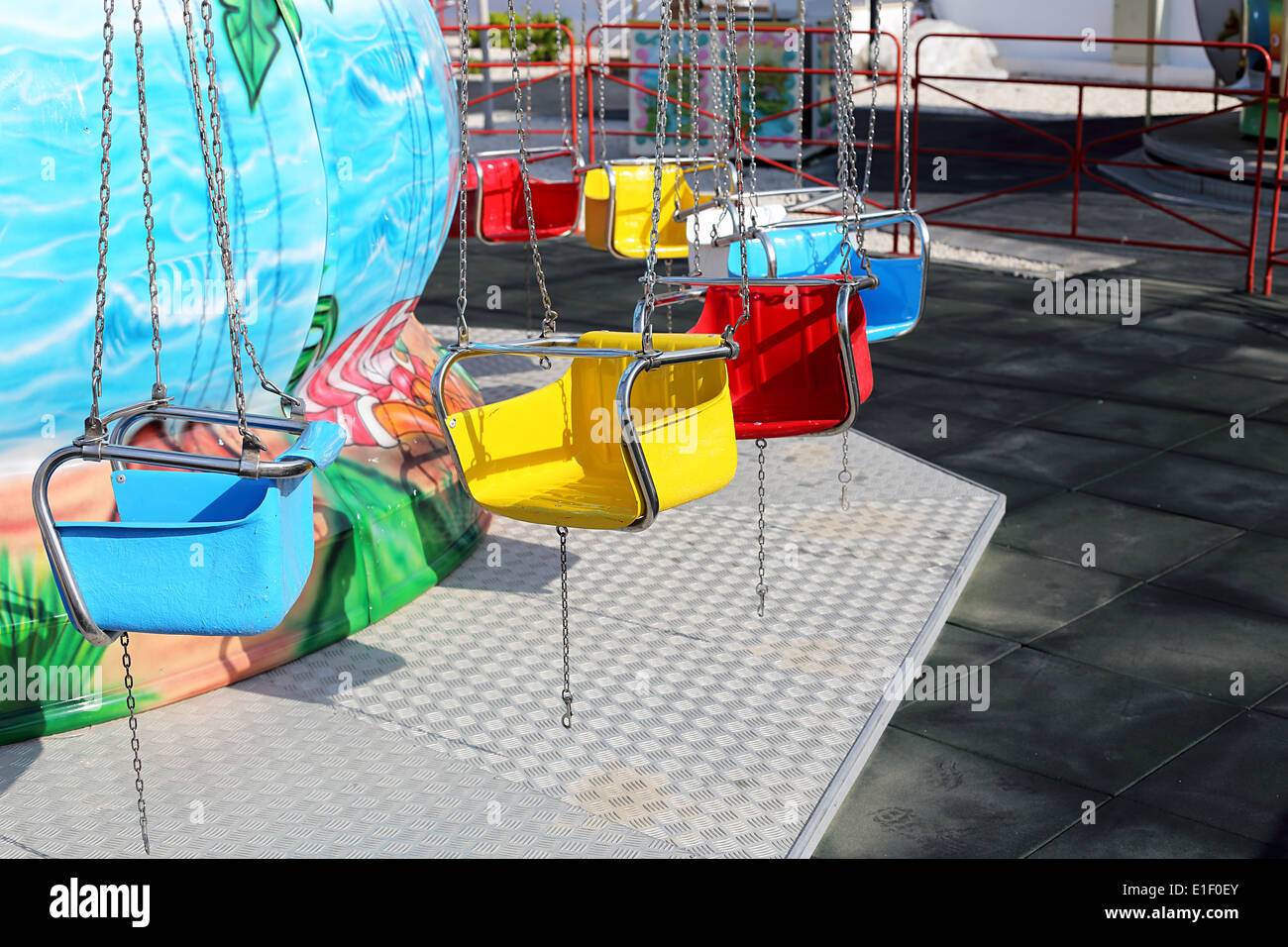 Swings in Amusement Park Stock Photo - Alamy