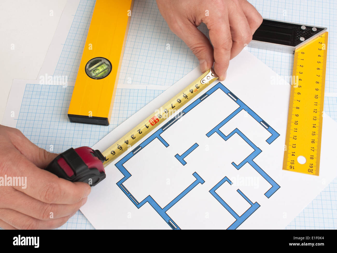 development drawings and tools on graph paper Stock Photo - Alamy