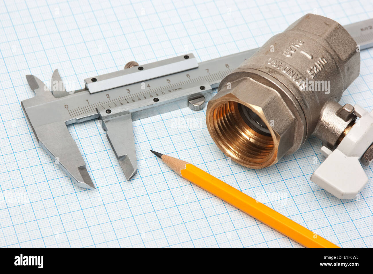 water inlet valve on a background of graph paper Stock Photo - Alamy