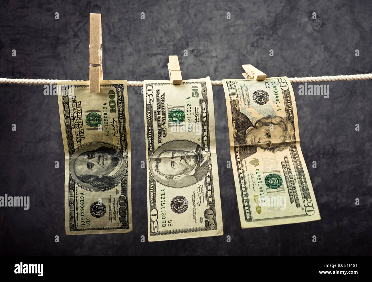 American currency. USA money, Dollar bills hanging on rope attached ...
