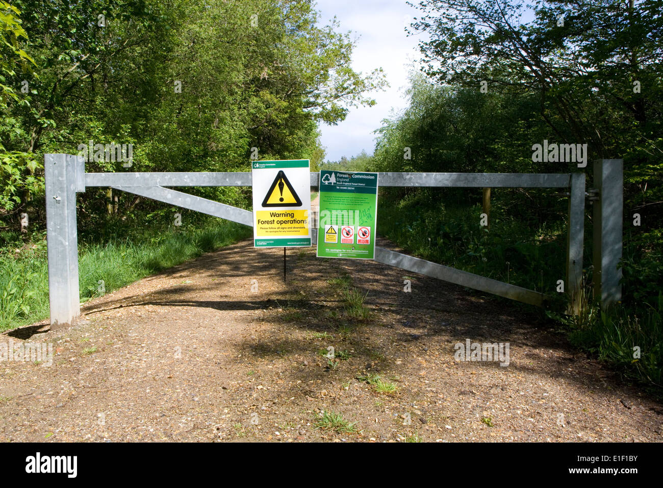 Forest track barrier & signage Stock Photo - Alamy
