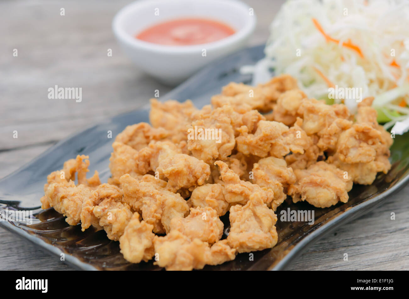 deep fried chicken tendons with fresh vegetable and chili sauce, asian ...