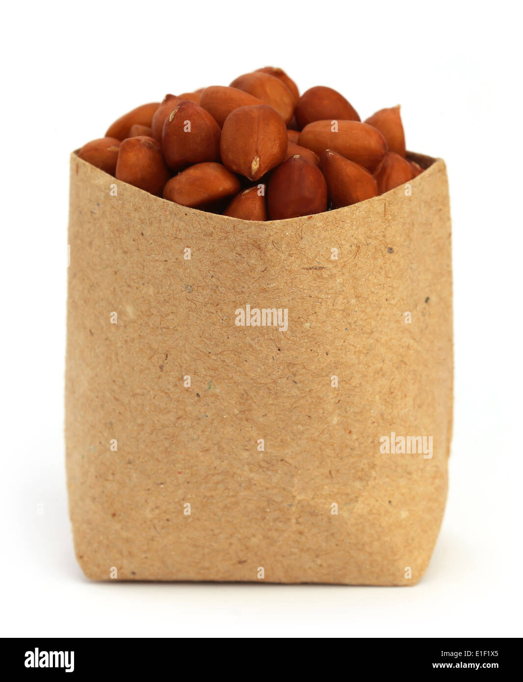 Peanut in a paper pack over white background Stock Photo - Alamy