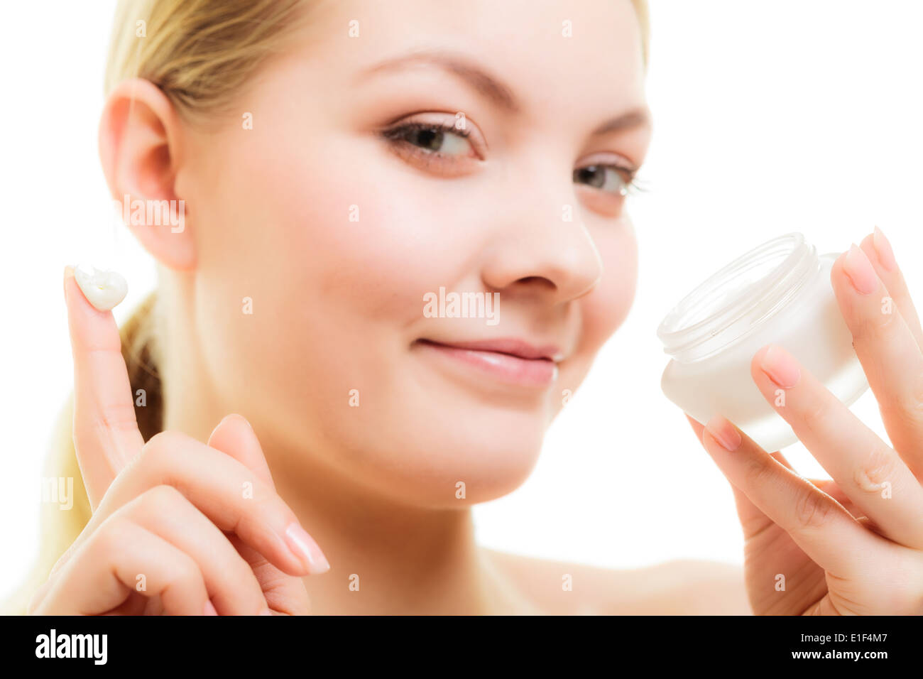 Skin care. Girl applying moisturizing cream Stock Photo - Alamy
