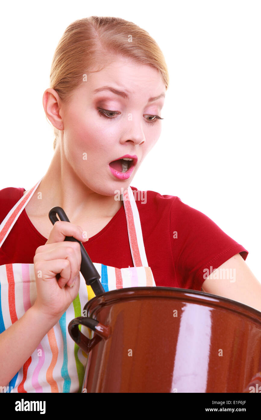 Surprised shocked emotional housewife or chef in colorful kitchen apron ...