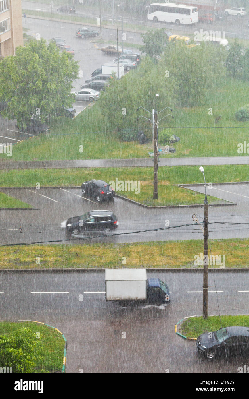 above view of urban street in heavy rain in summer day Stock Photo - Alamy