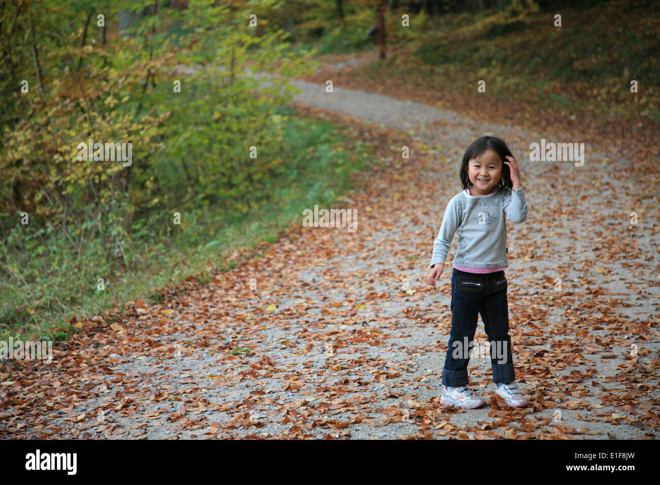 child outdoor in forest having fun Stock Photo - Alamy