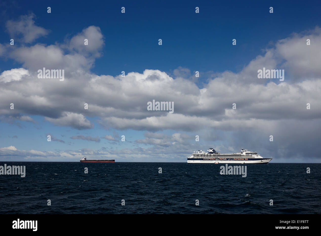 large cruise ship and oil tanker offshore in shallow water port Punta ...