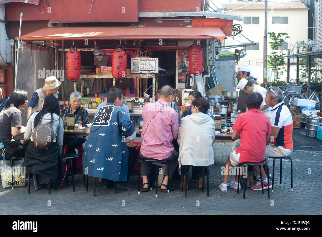 Tokyo Japan - People eating outdoors at food stall Asakusa district ...