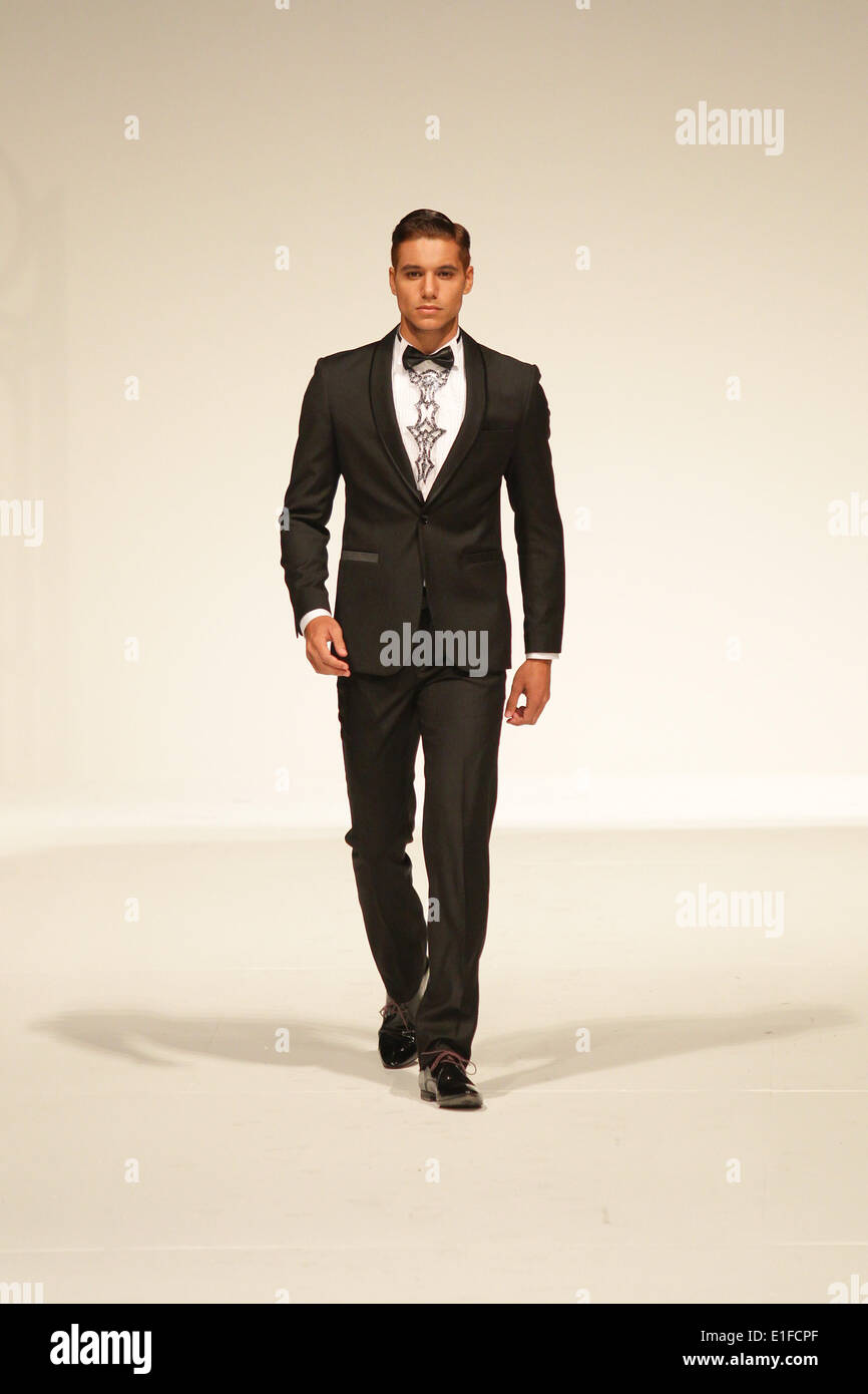 A model presents a creation of Albert Andrada during the Philippine ...