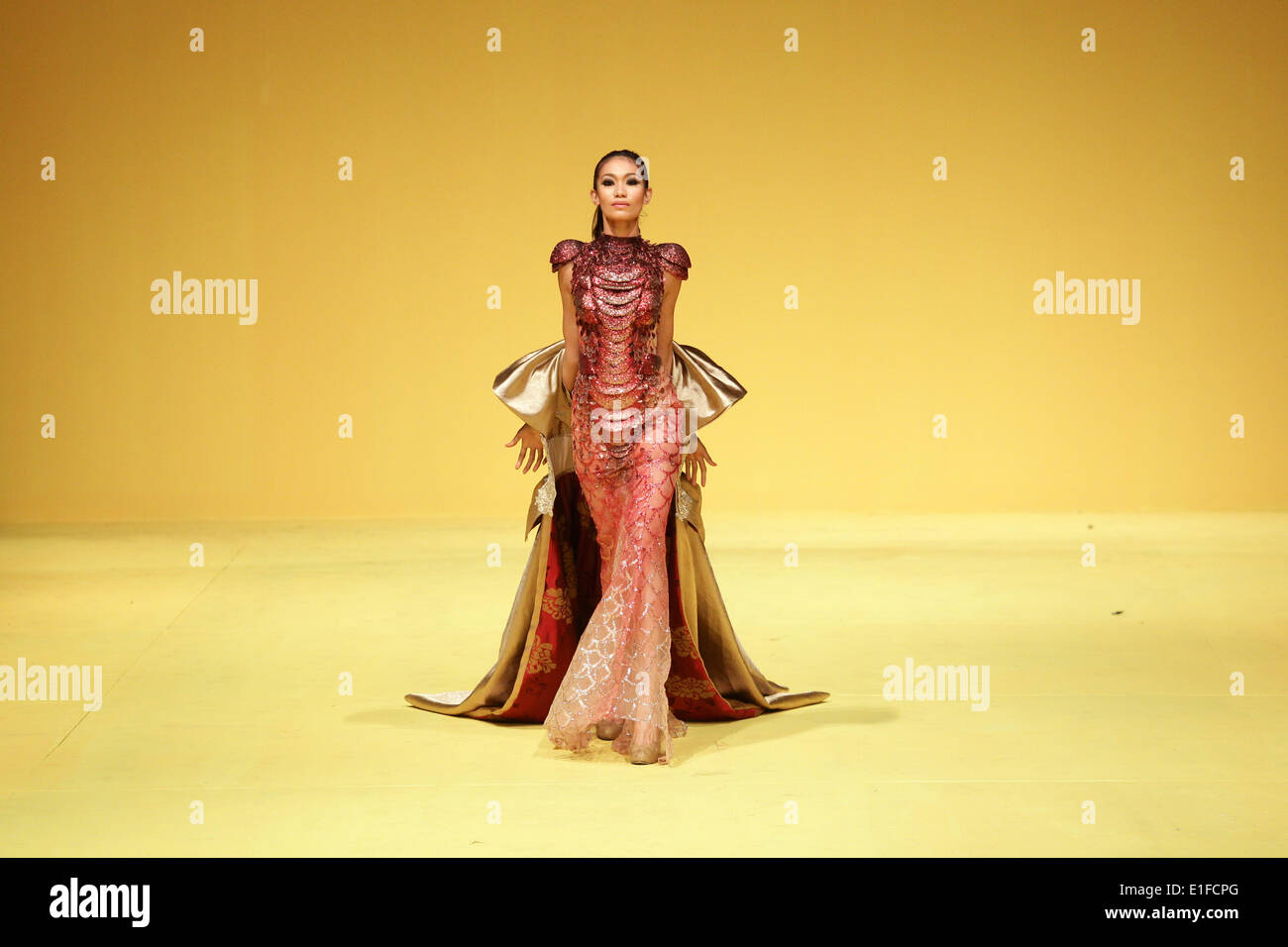A model presents a creation of Philipp Tampus during the Philippine ...