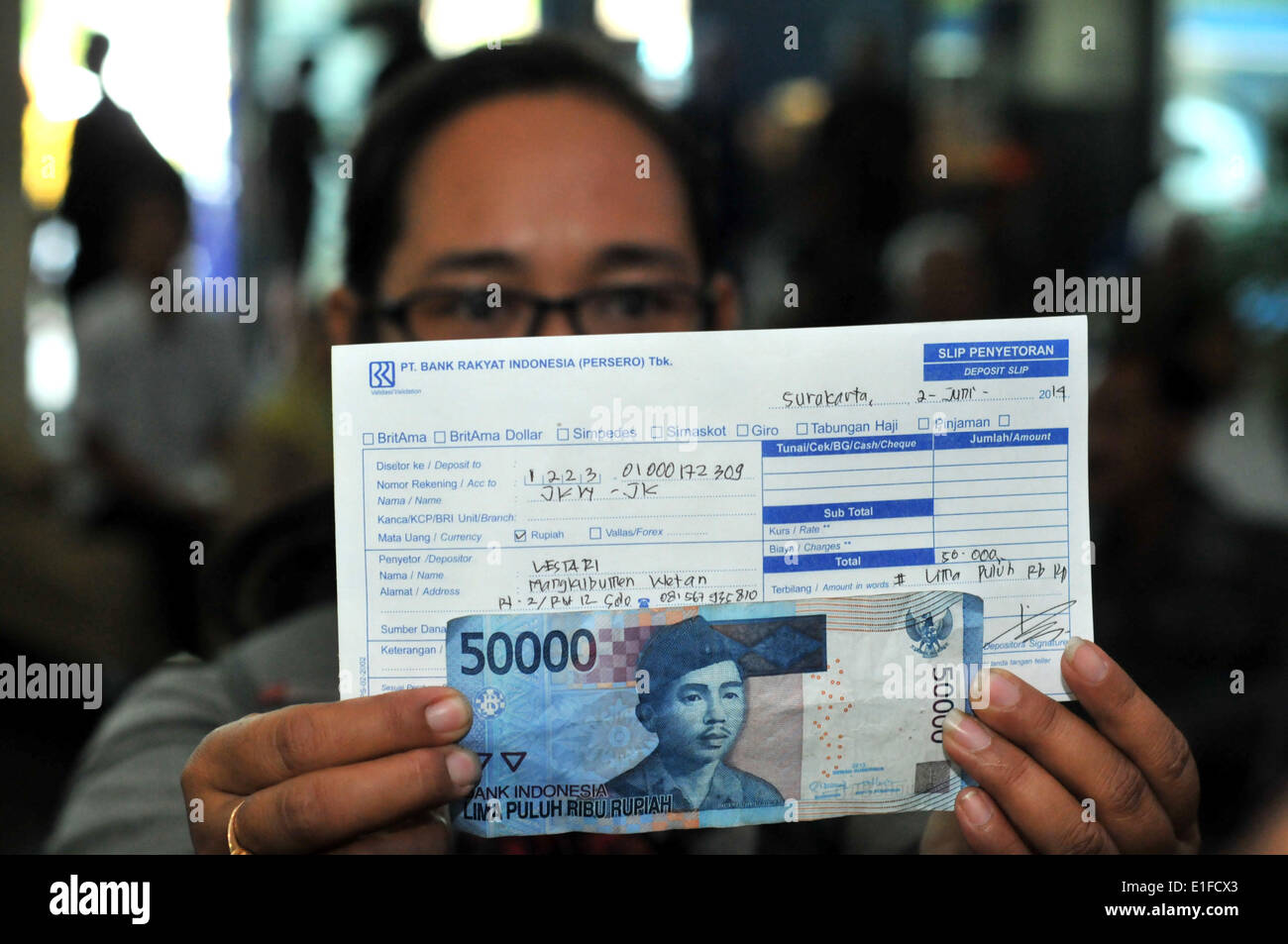 Indonesia money transfer hi-res stock photography and images - Alamy