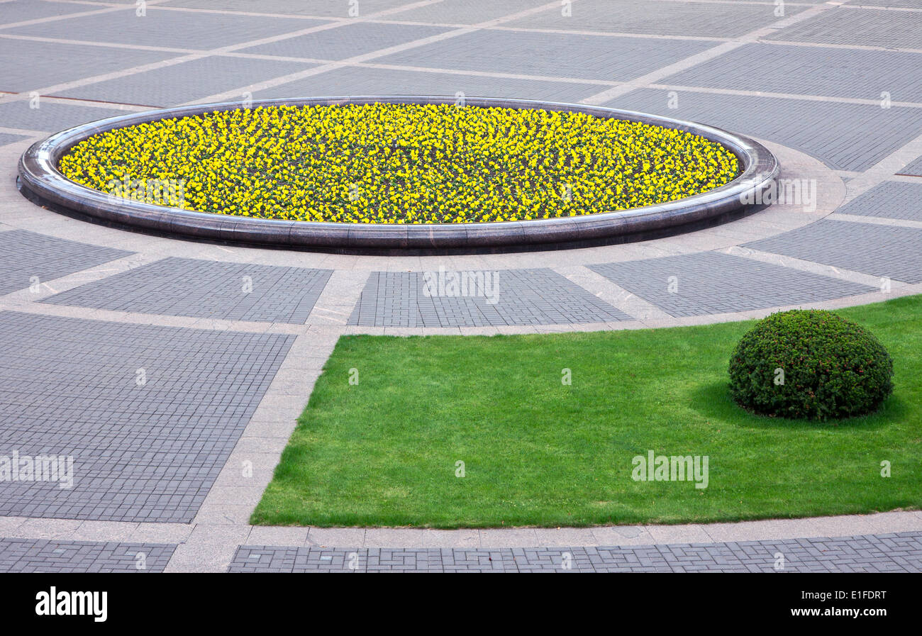 Detail of landscaped square with flowers and lawn Stock Photo - Alamy
