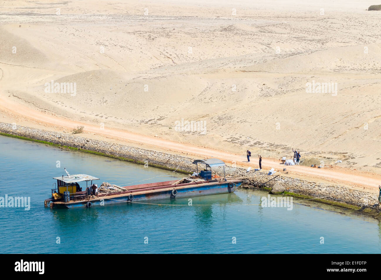 Barge moored and being loaded in the Suez Canal Egypt Stock Photo - Alamy