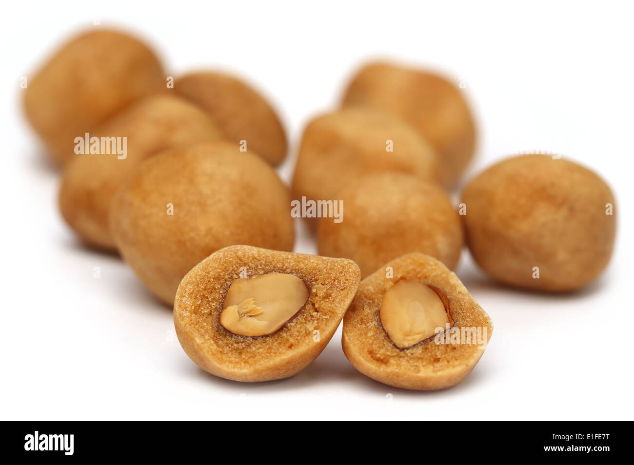 Coated Peanuts over white background Stock Photo - Alamy