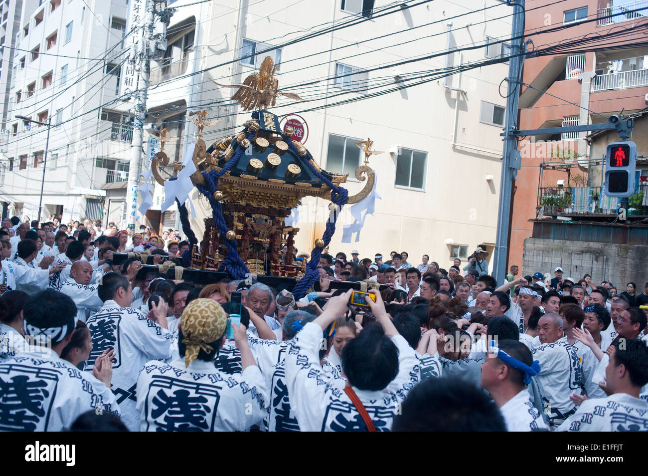 Tokyo, Japan - May 2014 - People attend to see carrying portable Shinto ...