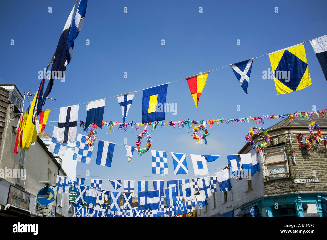 Flags strung across the streets of Padstow for the May Day celebrations ...