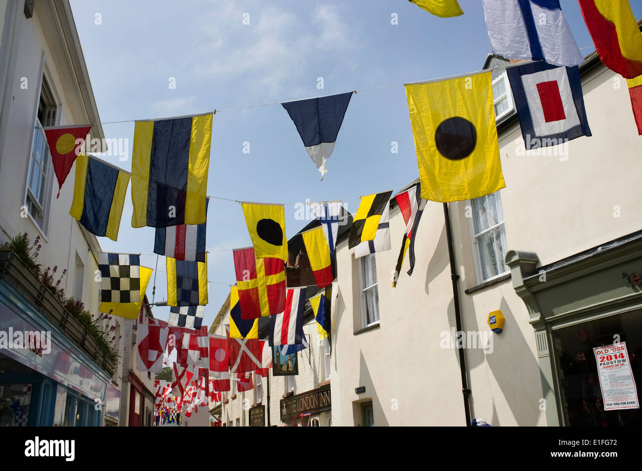 Flags strung across street hi-res stock photography and images - Alamy