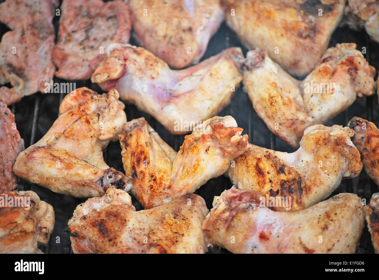 Fried meat on grill Stock Photo - Alamy