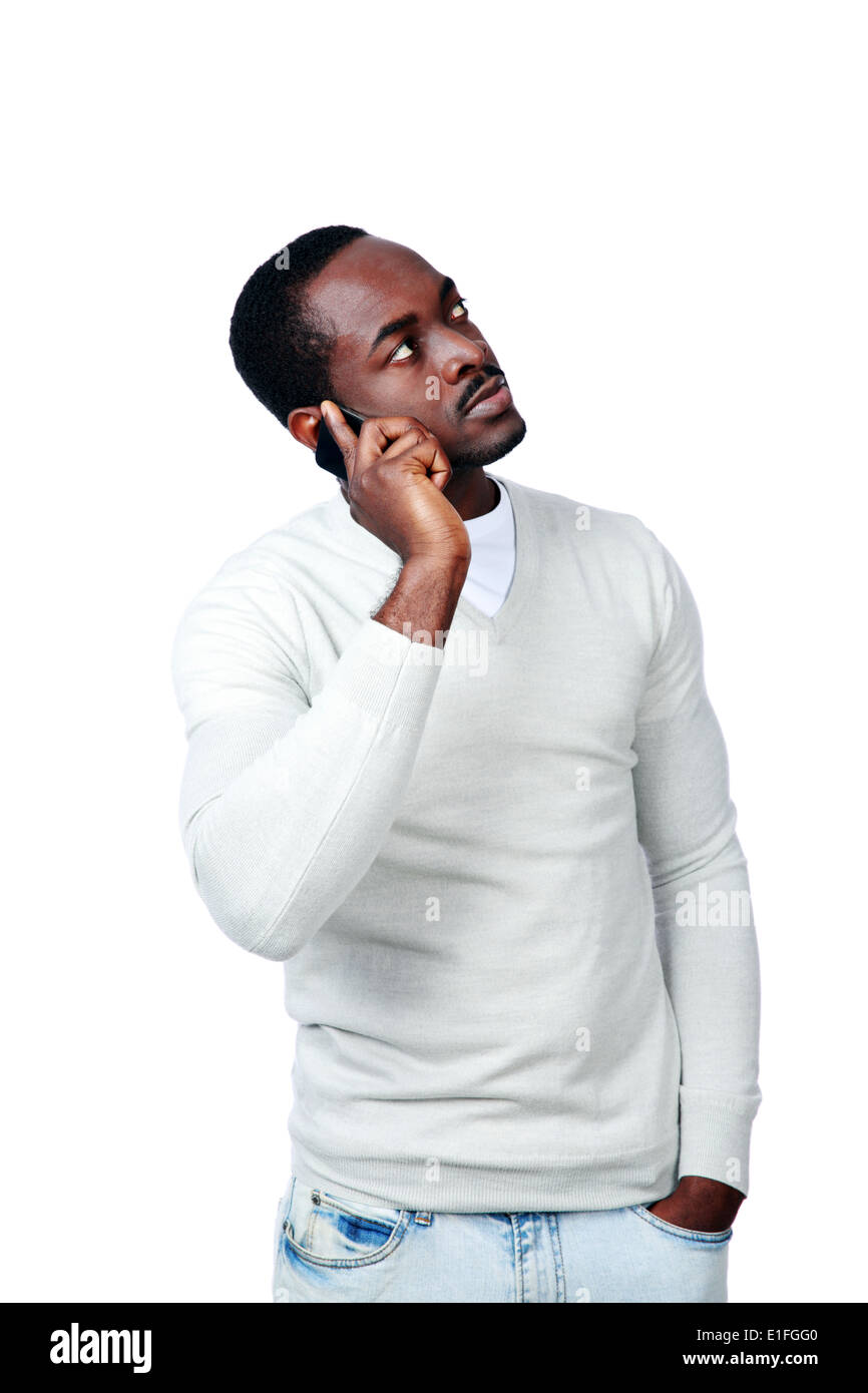 Portrait of african man talking on the phone isolated on a white ...