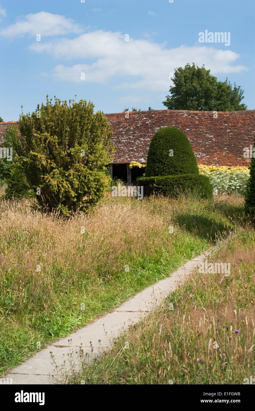 The Topiary Lawn created by the gardener Christopher Lloyd at Great Dixter in Northiam, East ...
