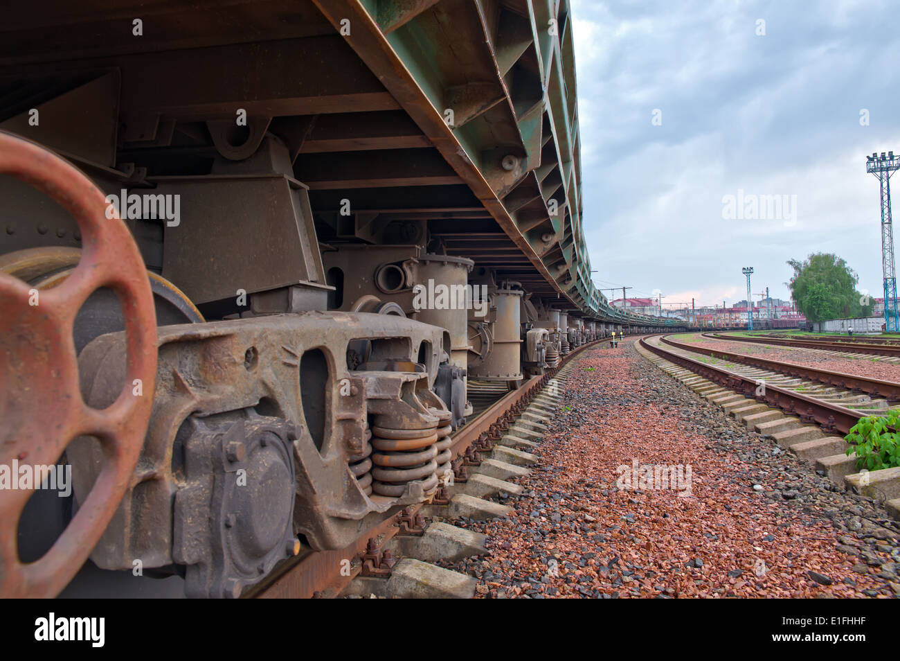 Cargo train driving along the railway track Stock Photo - Alamy