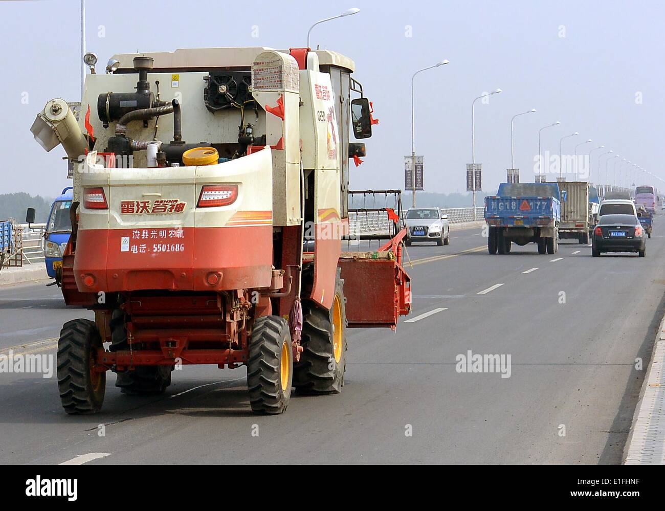 Zhengzhou, China's Henan Province. 3rd June, 2014. A combine harvester ...