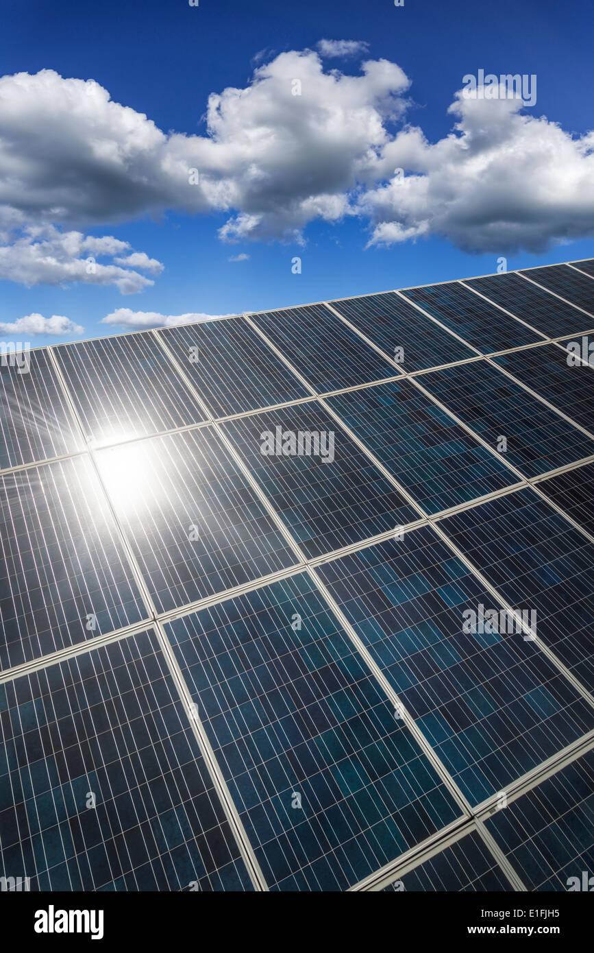 Reflection of the summer sun on solar panels Stock Photo - Alamy