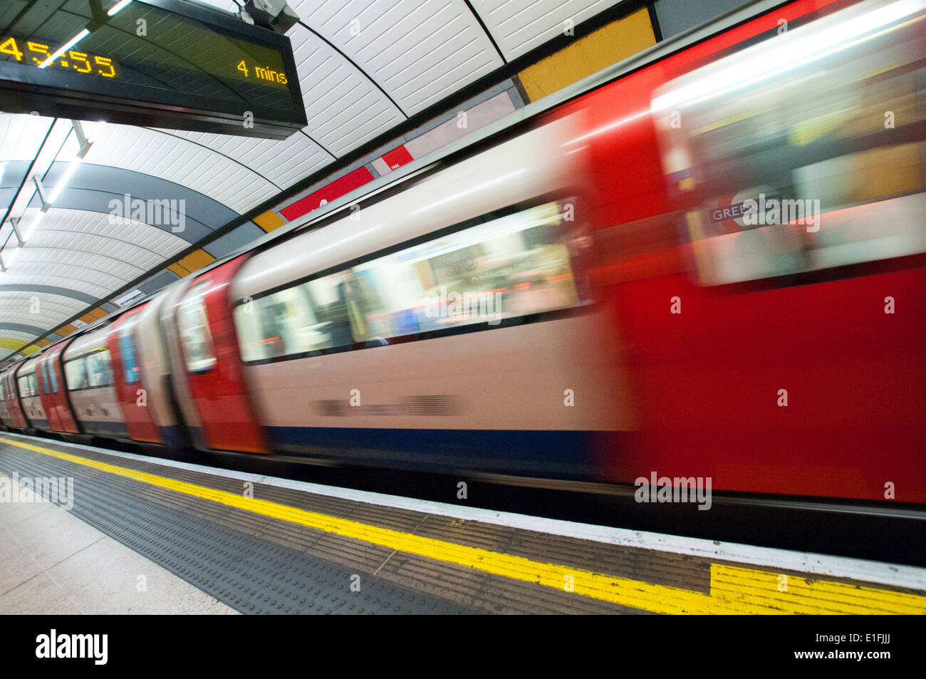 A train passing through a station on the London Underground, England UK ...