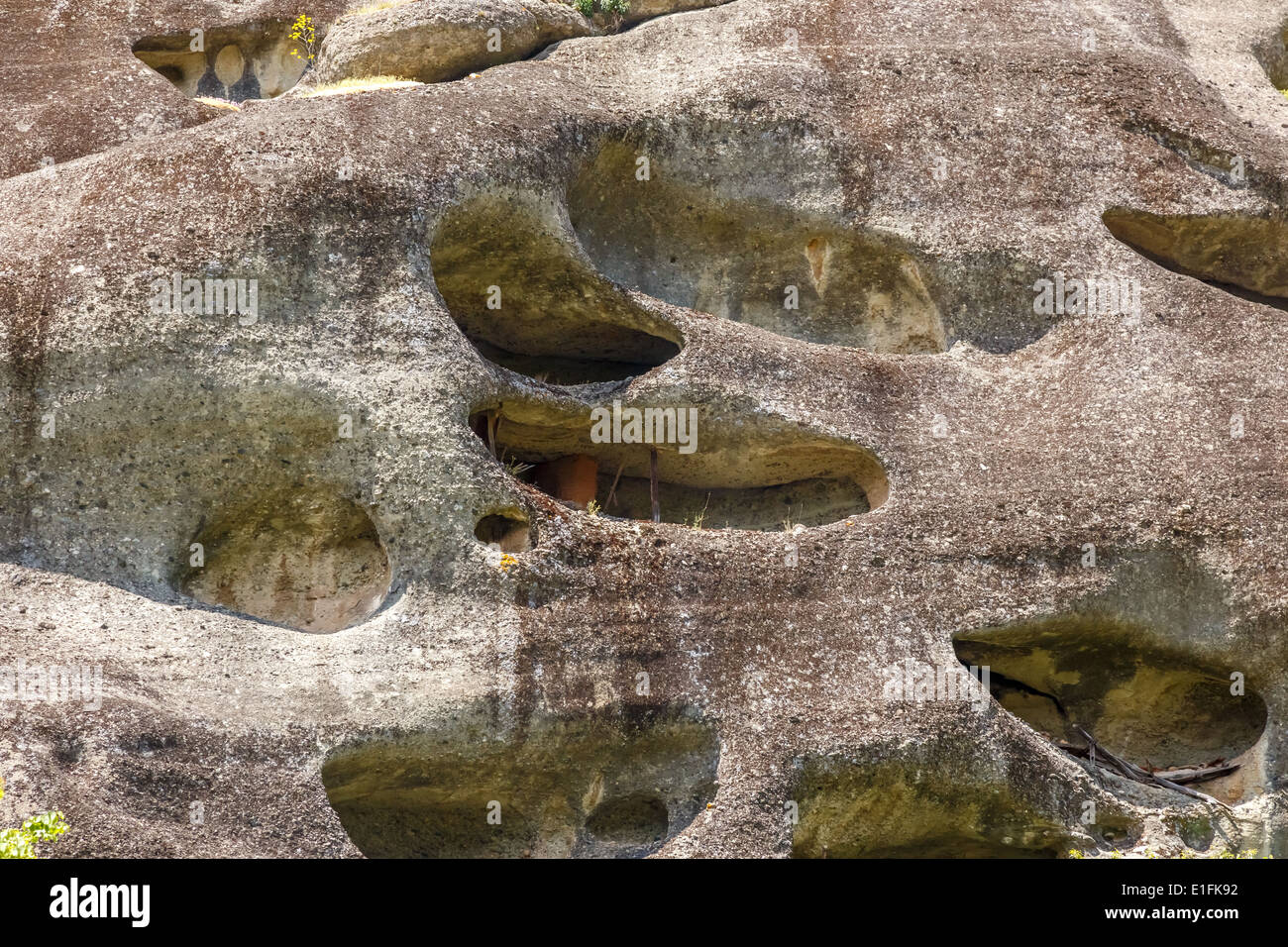 Abandoned monastic cave houses known as "cells" in Meteora (meaning ...