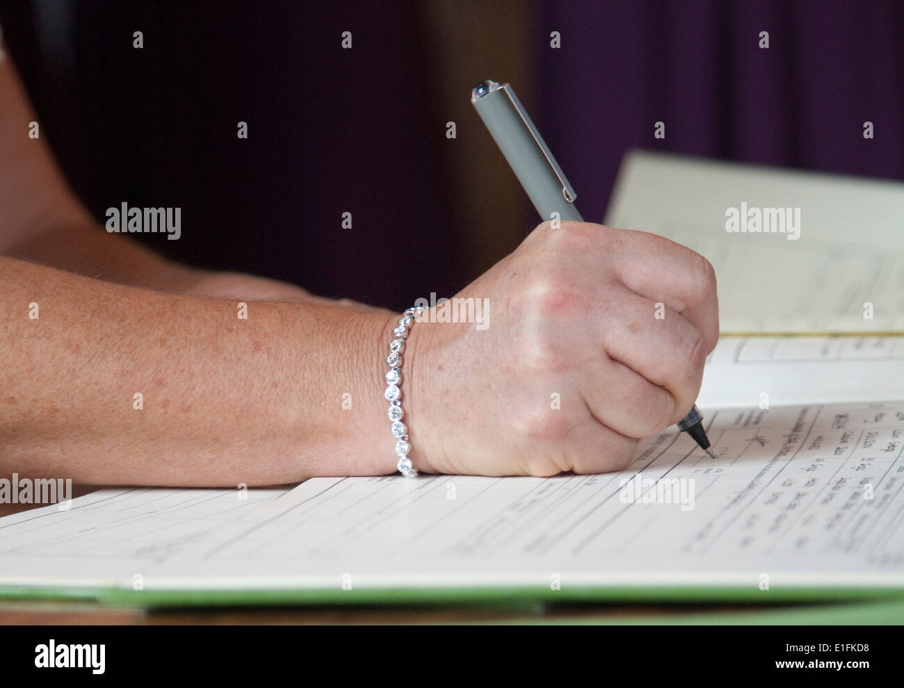 Signing wedding register Stock Photo - Alamy