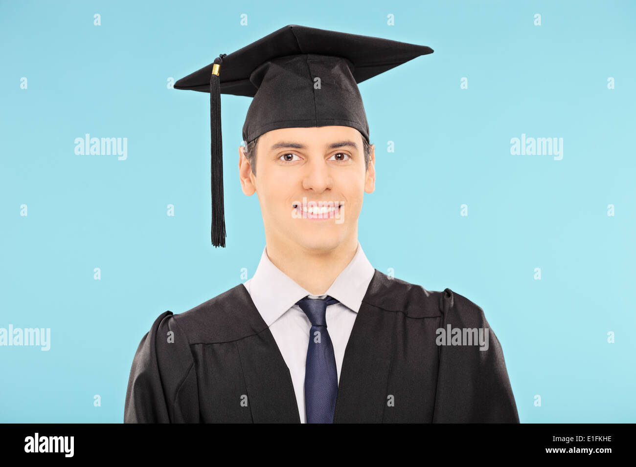 Portrait of a man with graduation hat Stock Photo - Alamy