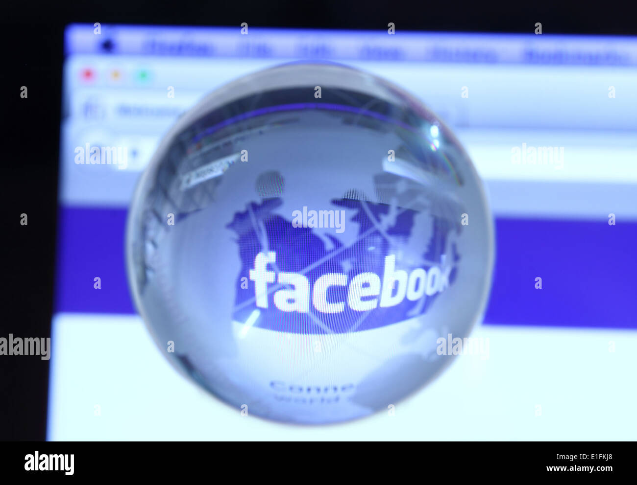Photo of Facebook webpage with glass globe. As of today, Facebook is ...