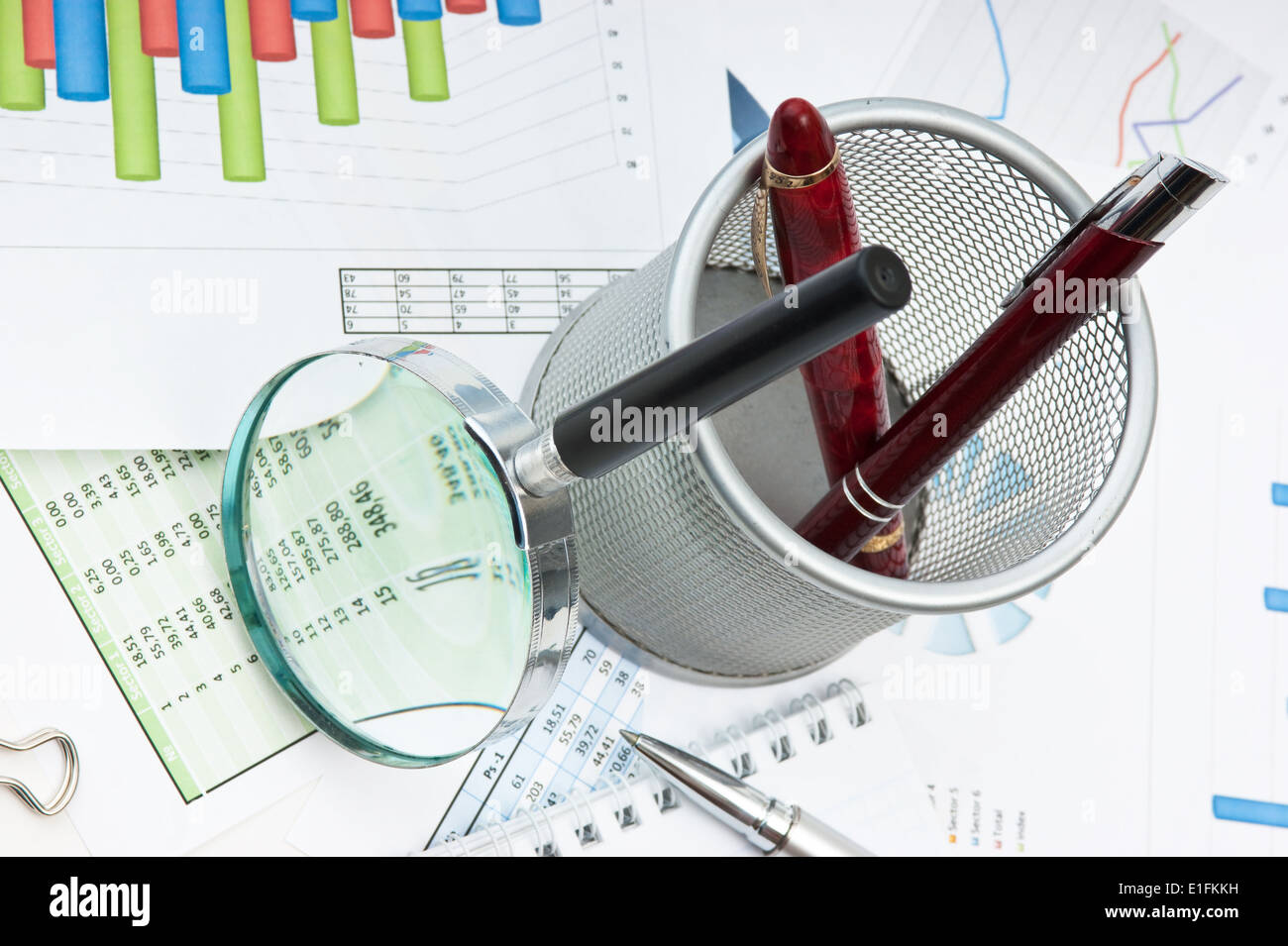 pen, magnifying glass and the working paper with a diagram Stock Photo ...