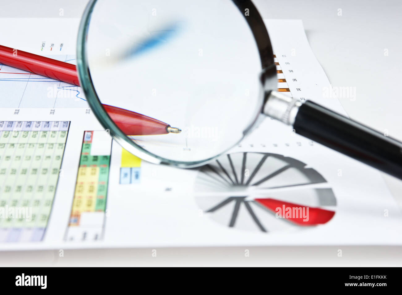 pen, magnifying glass and the working paper with a diagram Stock Photo ...