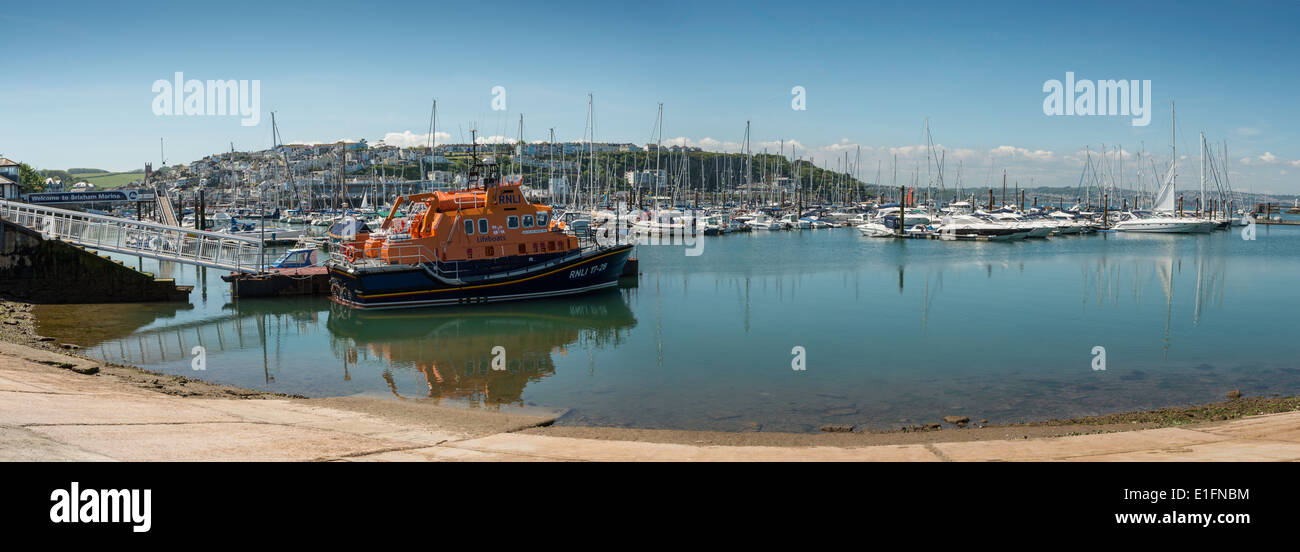 Panoramic view of Brixham Harbour with moored lifeboat and boats and ...