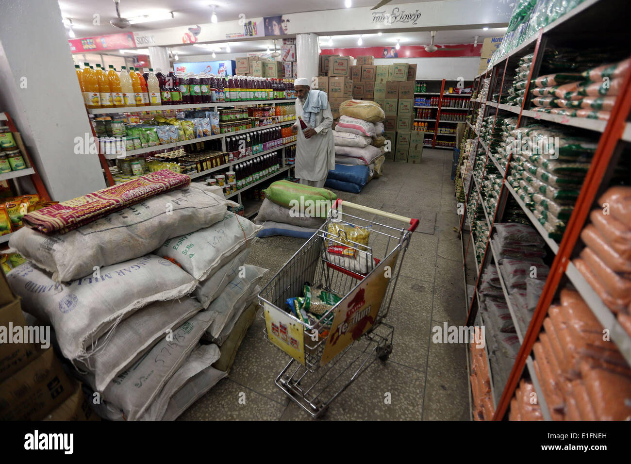 Peshawar. 3rd June, 2014. A Pakistani customer buys products at a ...