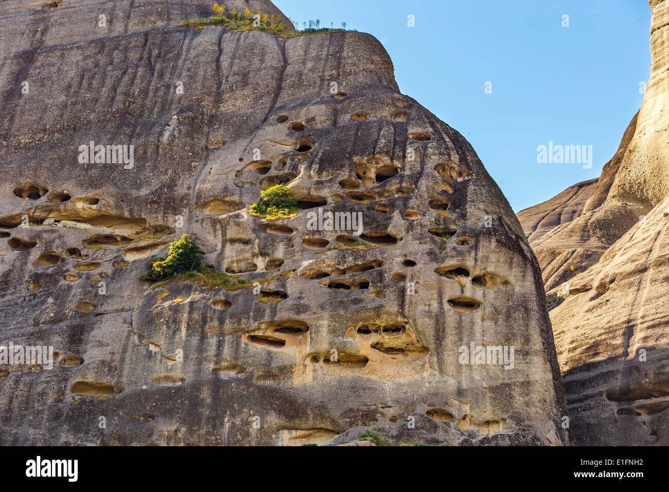 Abandoned monastic cave houses known as "cells" in Meteora (meaning ...