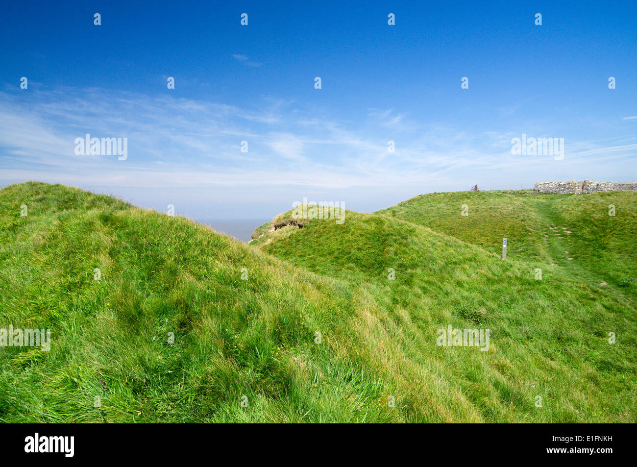 Ramparts and ditches of Iron Age Hillfort on cliffs Nash Point ...