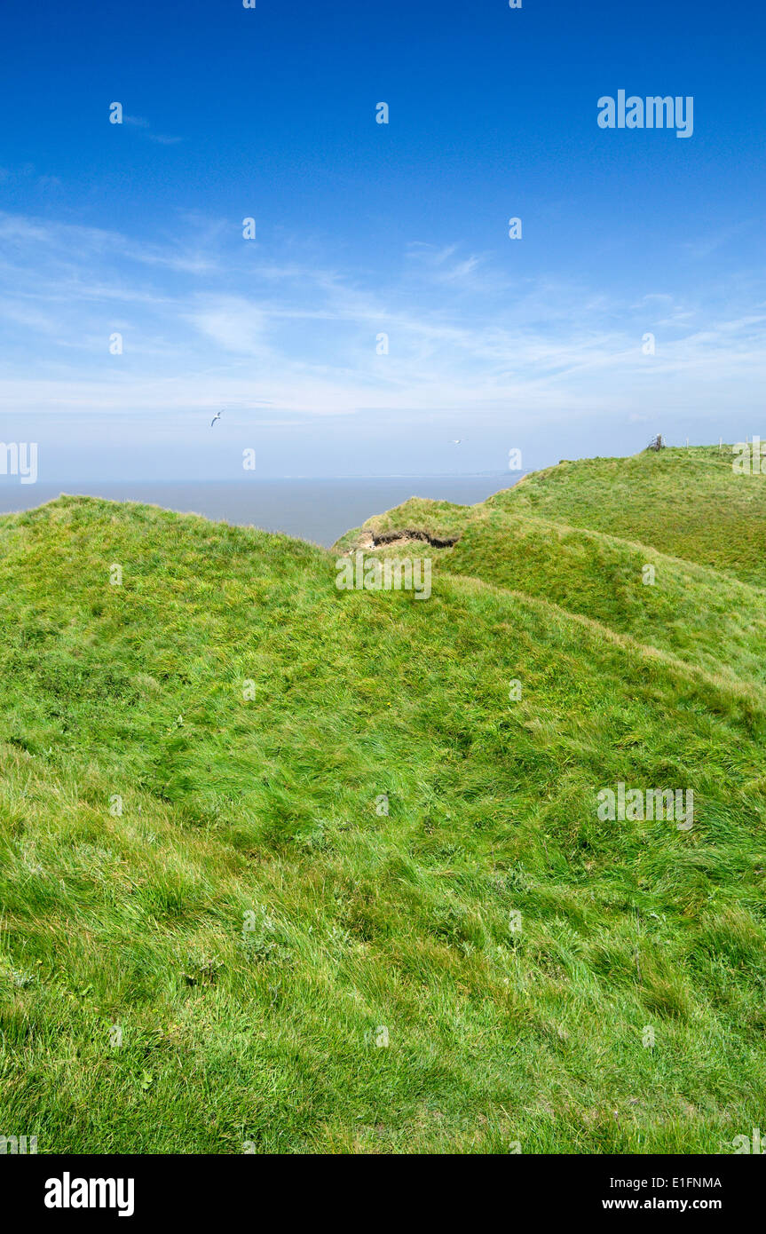 Ramparts and ditches of Iron Age Hillfort on cliffs Nash Point ...
