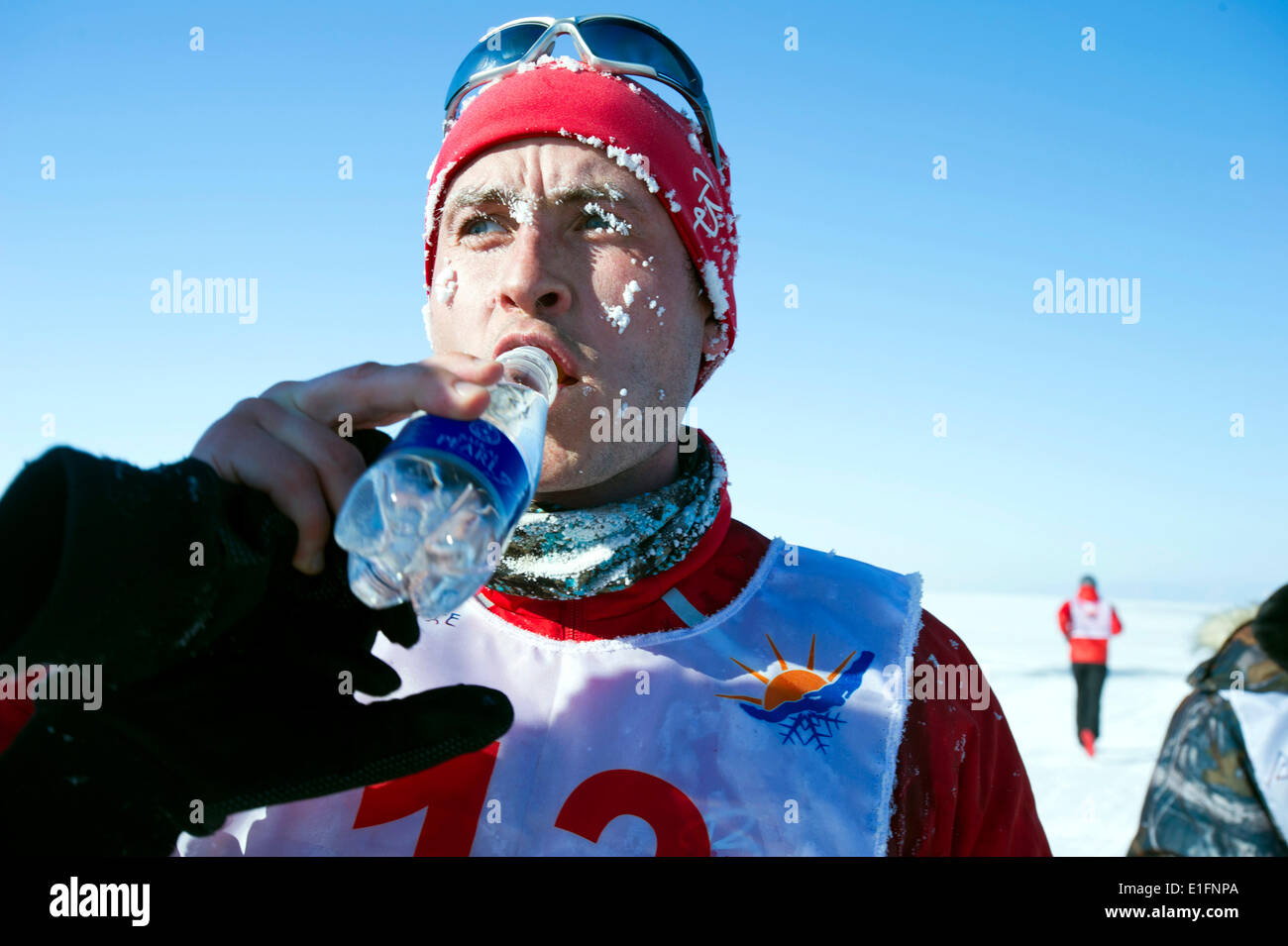 Runner in the 10th Baikal Ice Marathon, run on the frozen surface of ...
