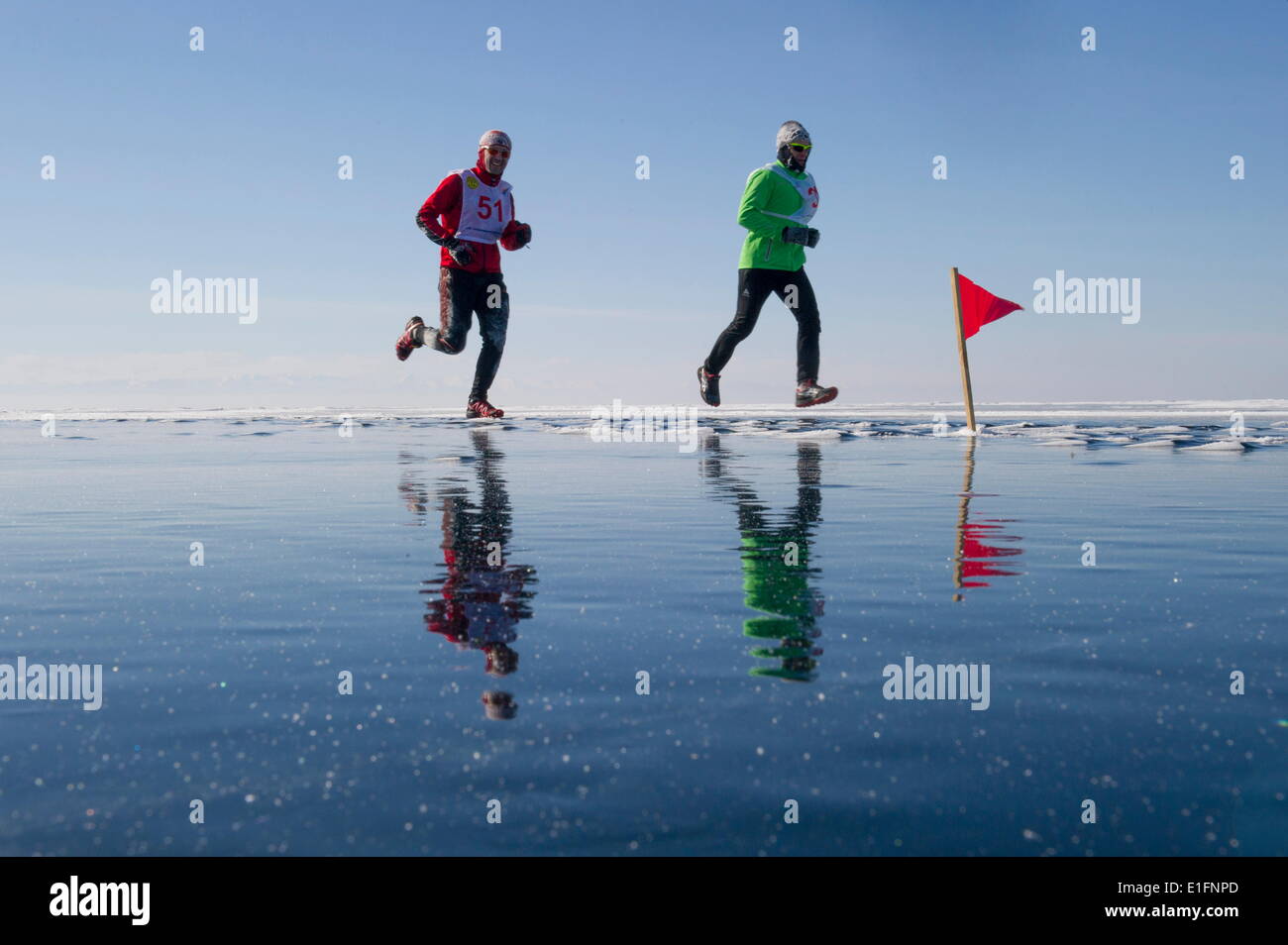 Runners in the 10th Baikal Ice Marathon, run on the frozen surface of ...