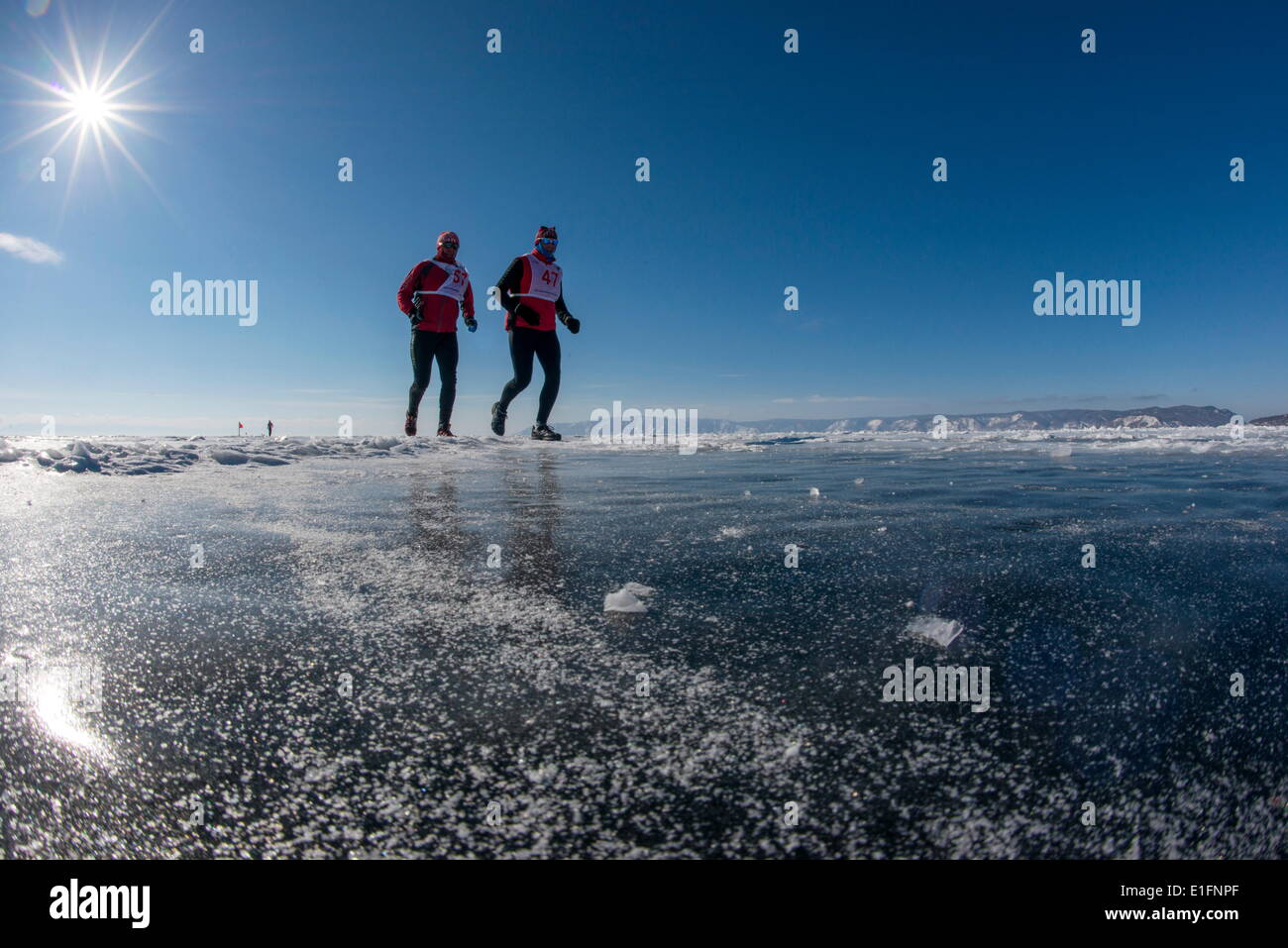 Runners in the 10th Baikal Ice Marathon, run on the frozen surface of ...