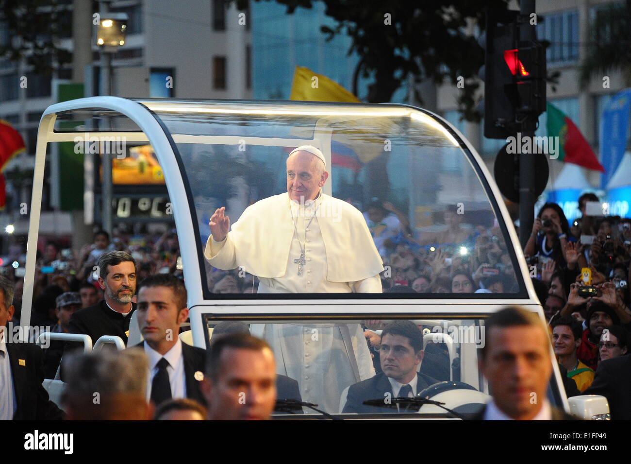 Pope Francis waves to the crowd while riding in the Popemobile, World ...