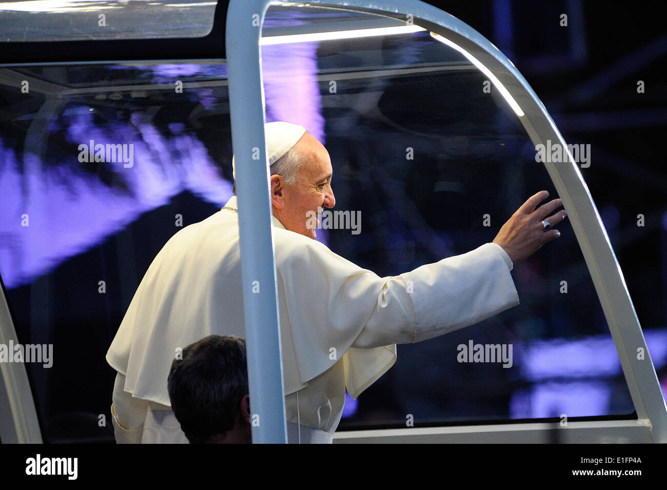 Pope Francis waves to the crowd while riding in the Popemobile, World ...