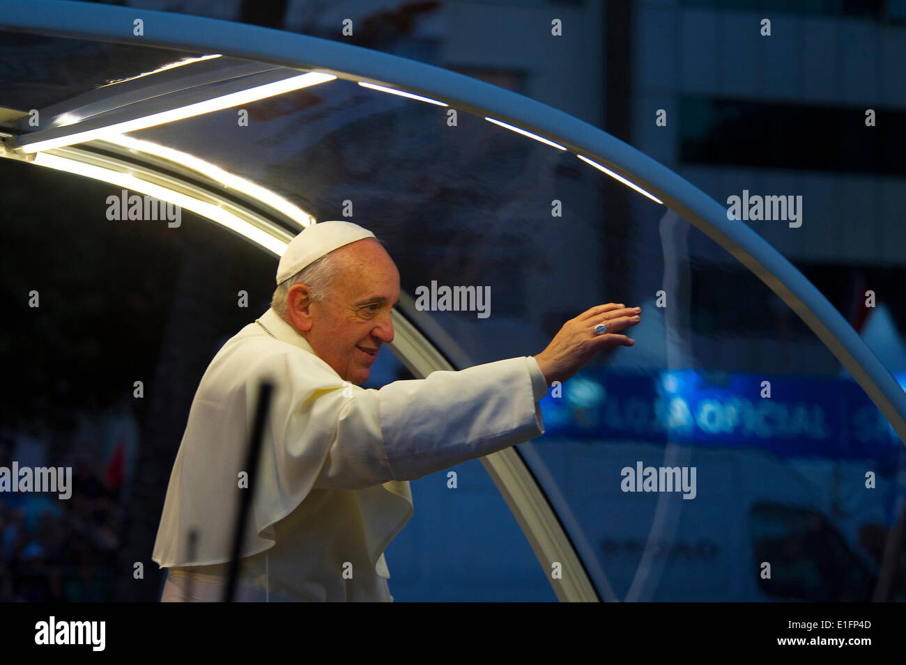 Pope Francis waves to the crowd while riding in the Popemobile, World ...