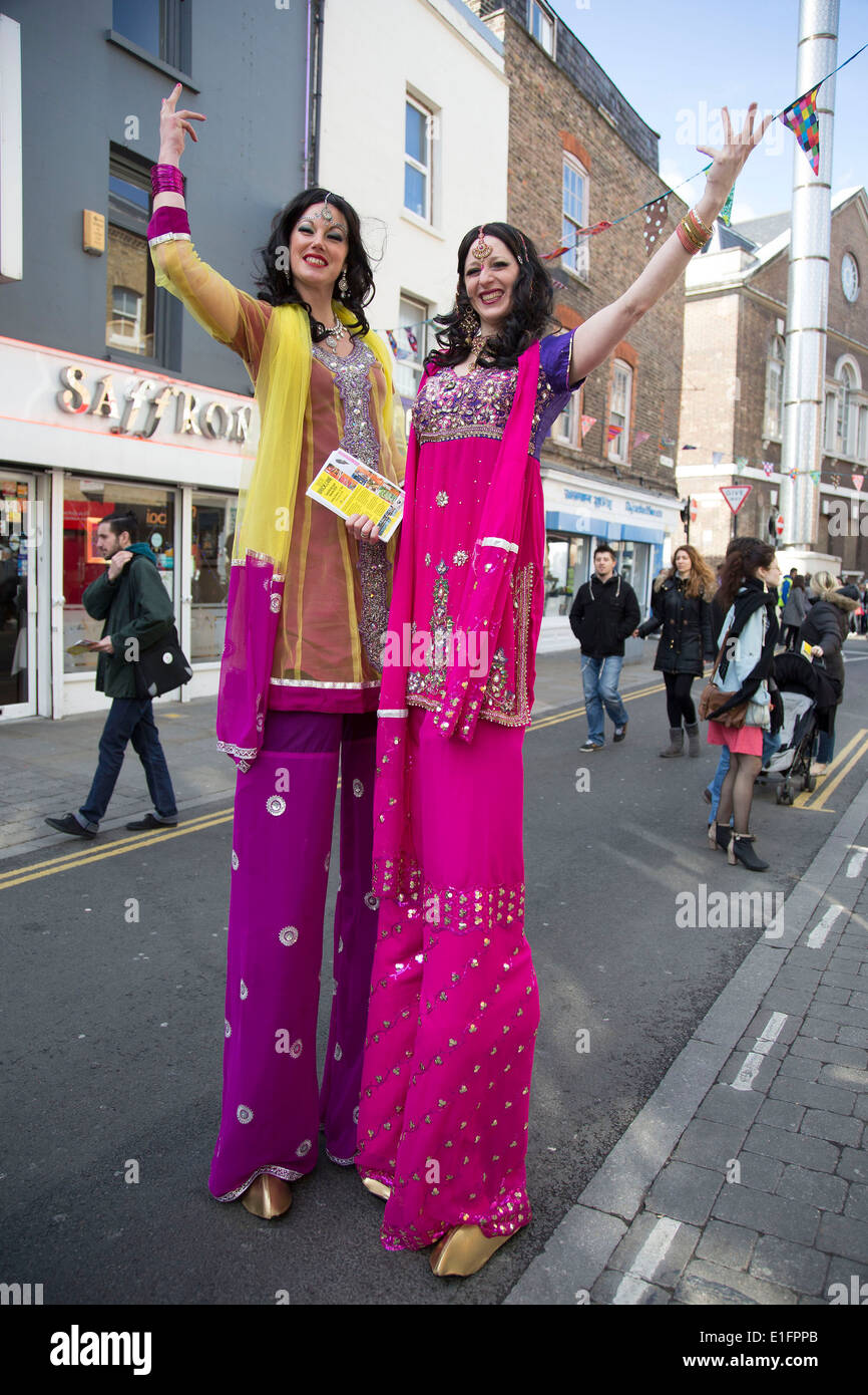 Stilt walkers at an Asian street food festival on Brick Lane, London ...