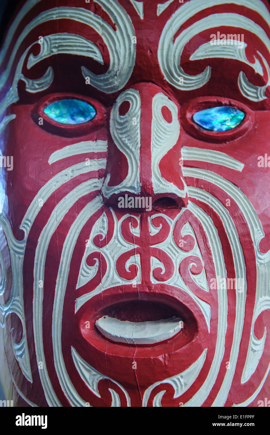 Traditional wood carved mask in the Te Puia Maori Cultural Center ...