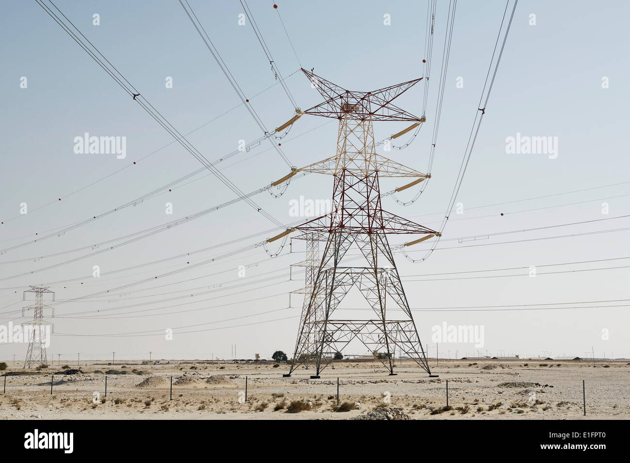 Electricity pylons dominate the desert skyline, Qatar, Middle East ...